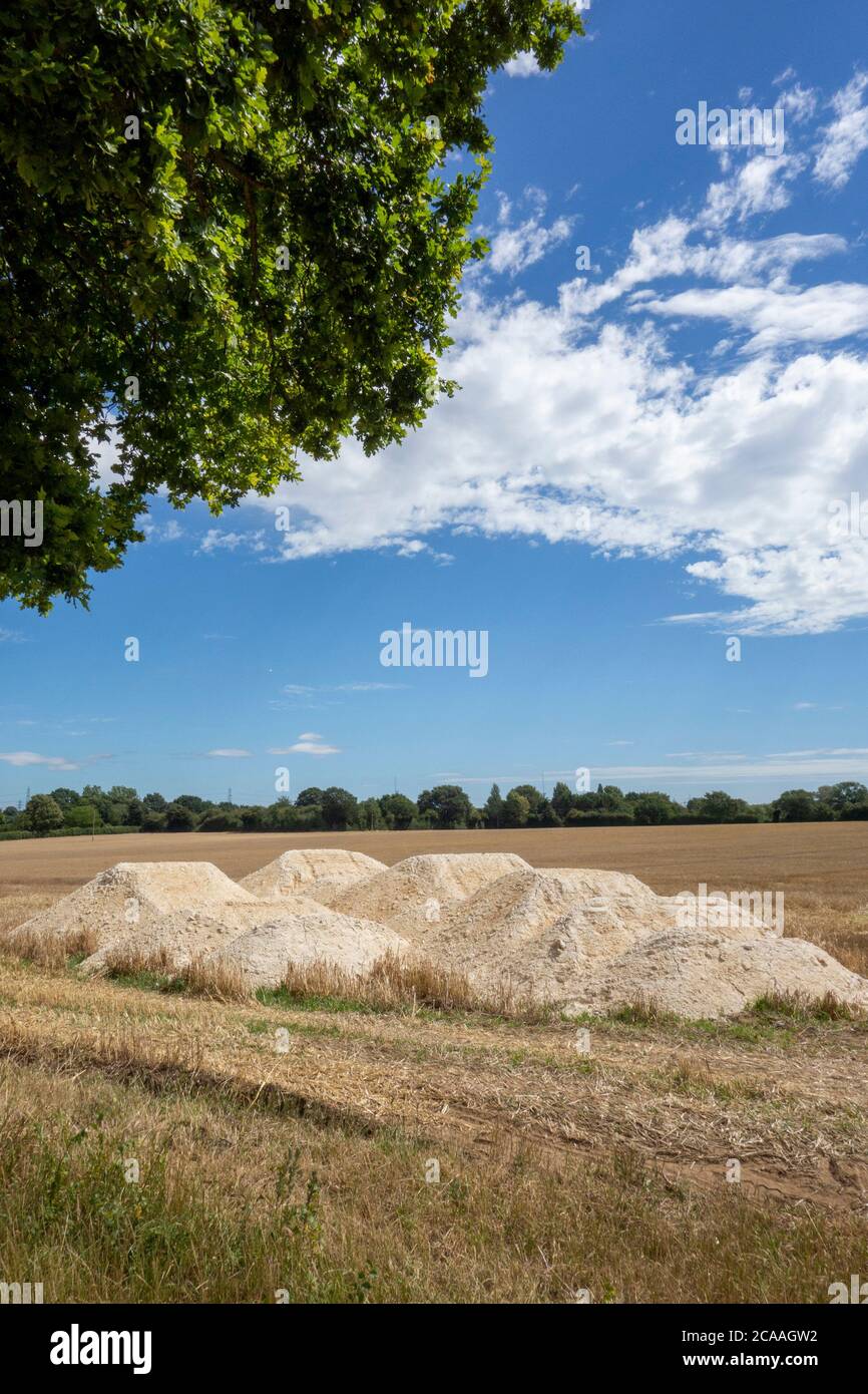 Pile of agricultural lime in field Stock Photo - Alamy