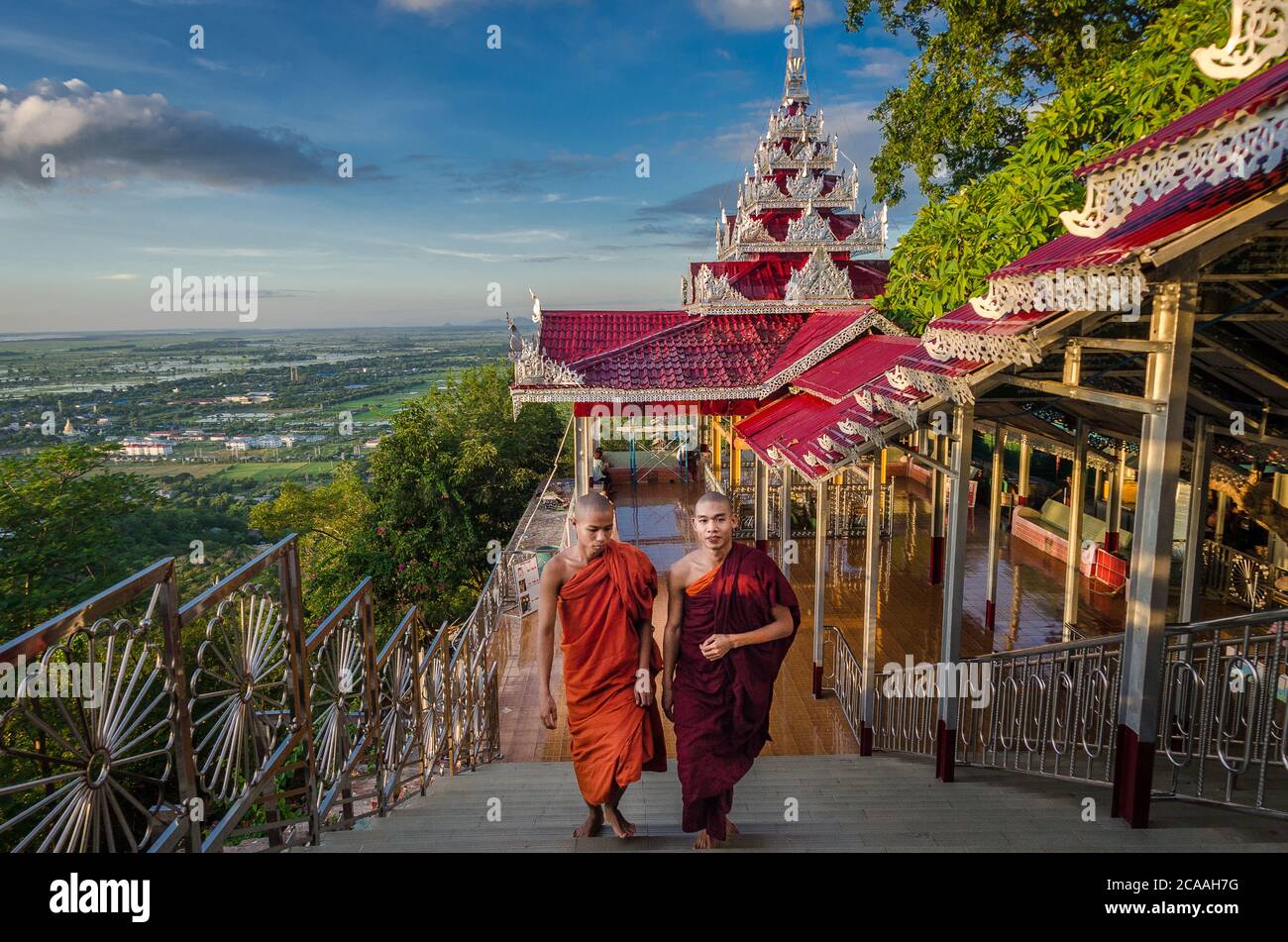 Two monks leaving a pagoda Stock Photo - Alamy