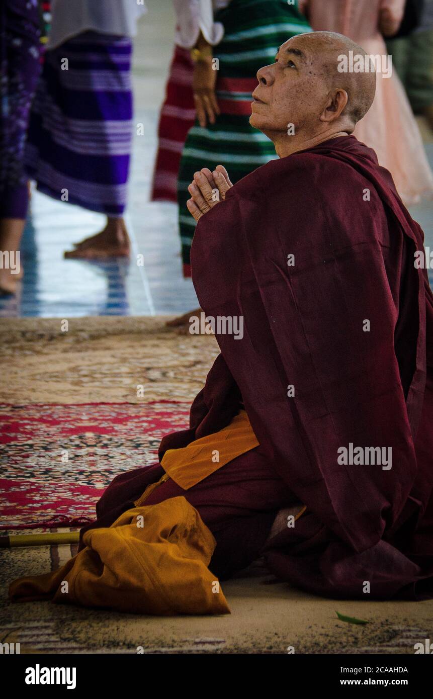 Buddhist monk in prayer Stock Photo - Alamy