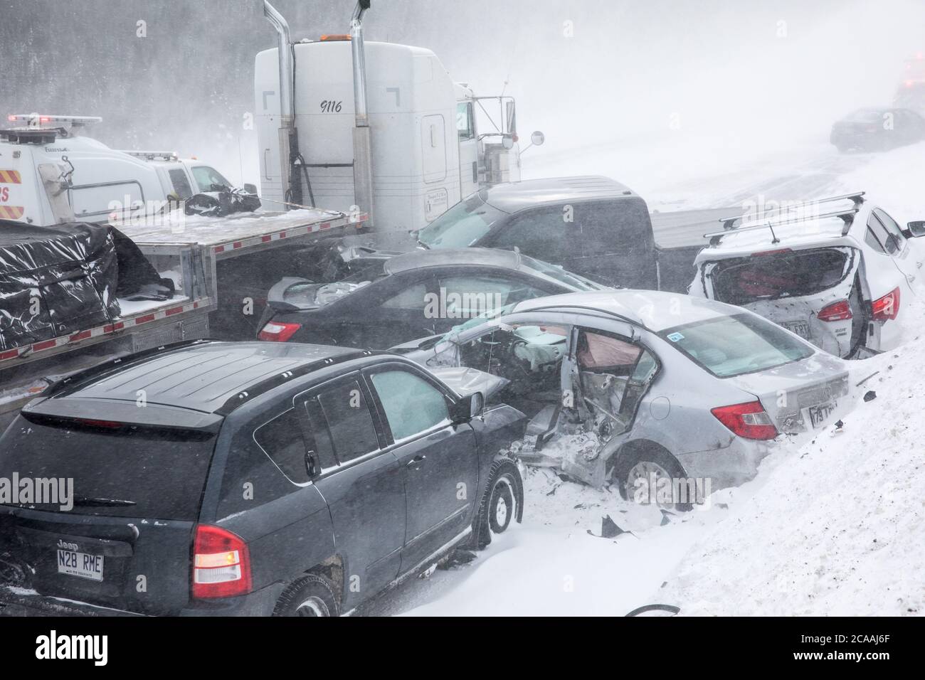 Pileup - Multi crash on road with snow storm Stock Photo - Alamy