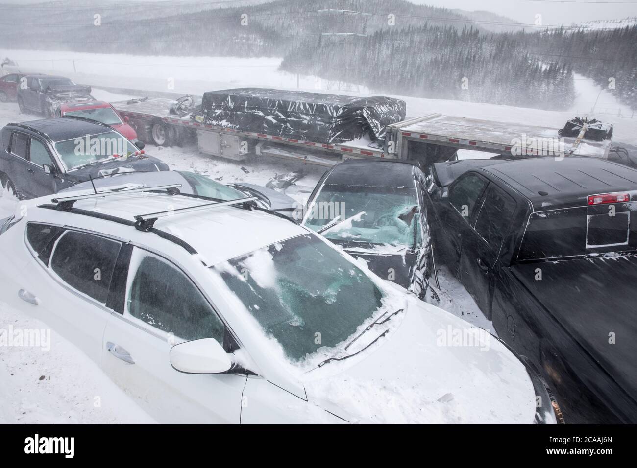 Pileup - Multi crash on road with snow storm Stock Photo - Alamy