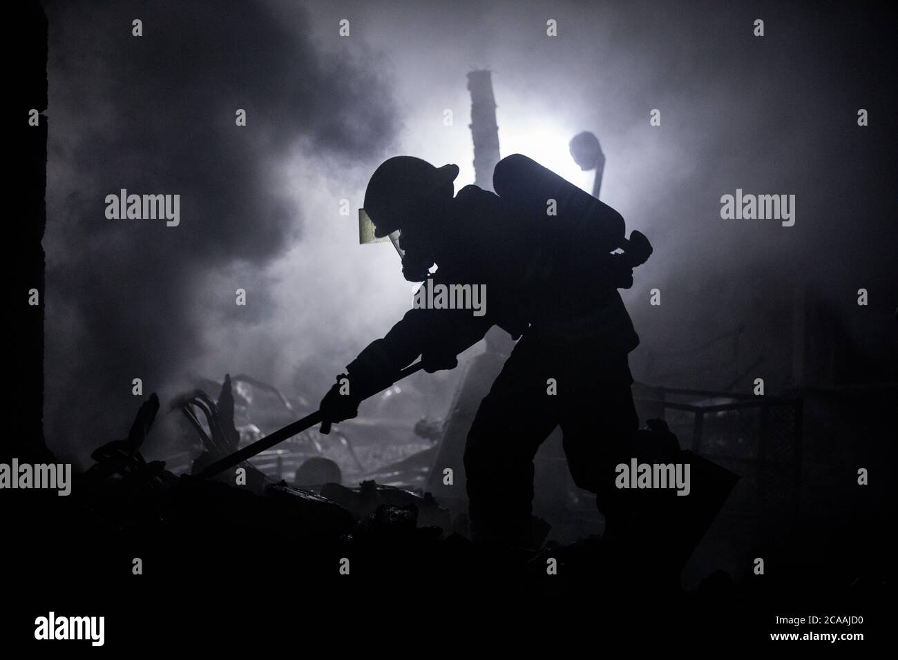 Firefighter using hose hi-res stock photography and images - Alamy