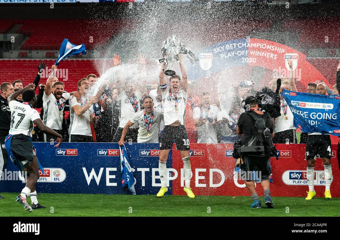 Lifting trophy behind hi-res stock photography and images - Alamy