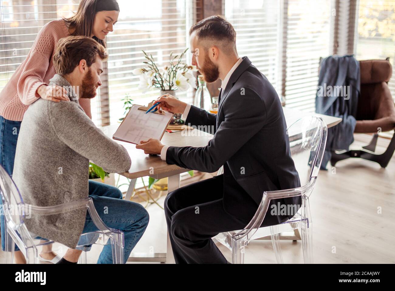 Caucasian respectable couple buying apartment, buyers of real estate ...