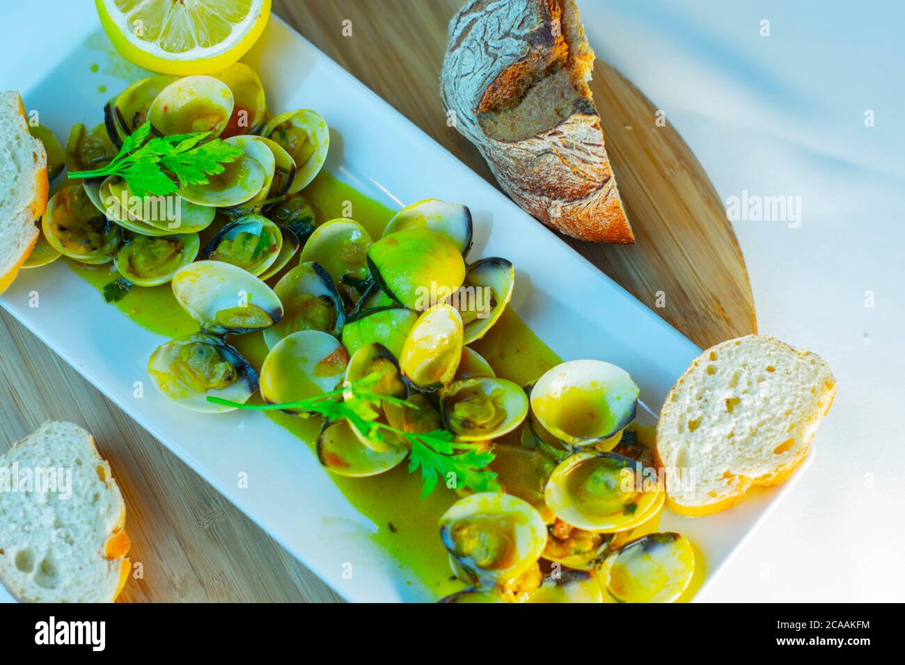 Close up shot of delicious looking clam with a side of lemon and ...