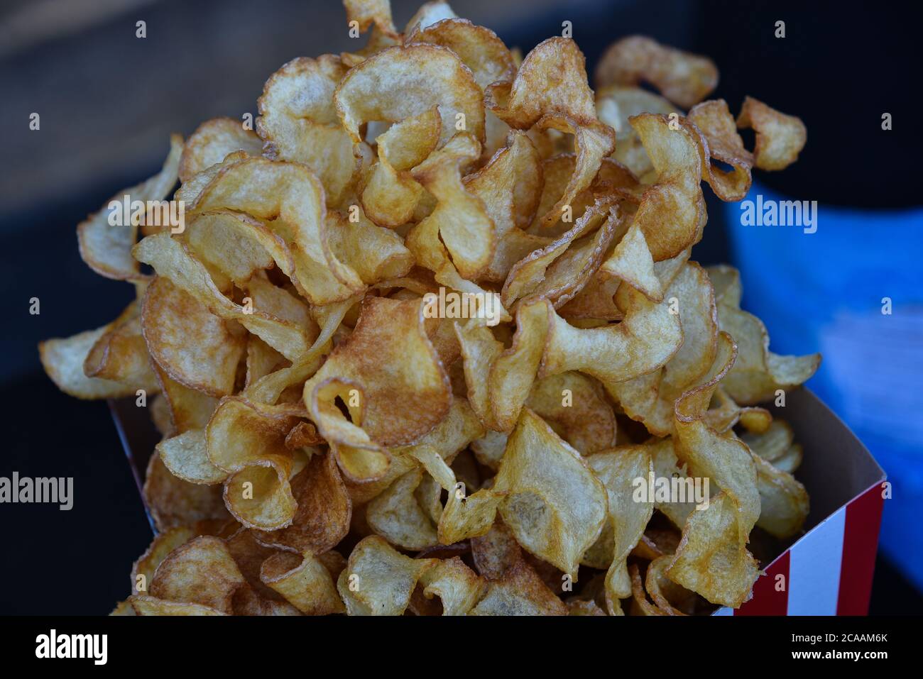 Spiral Cut Potato Chips at the Fair. Fried potato chips are spiral ...