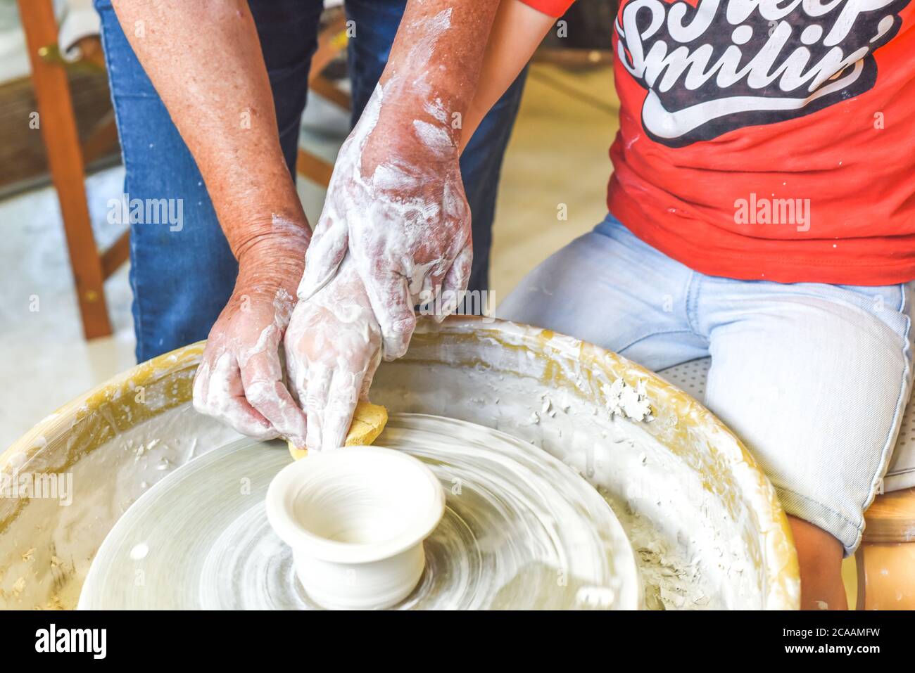 Children making pottery during ceramic lesson with clay Stock Photo - Alamy