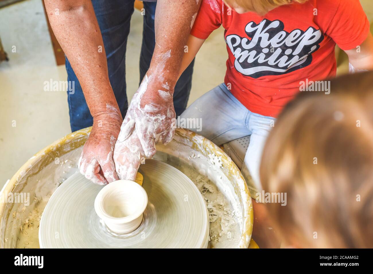 Children making pottery during ceramic lesson with clay Stock Photo - Alamy