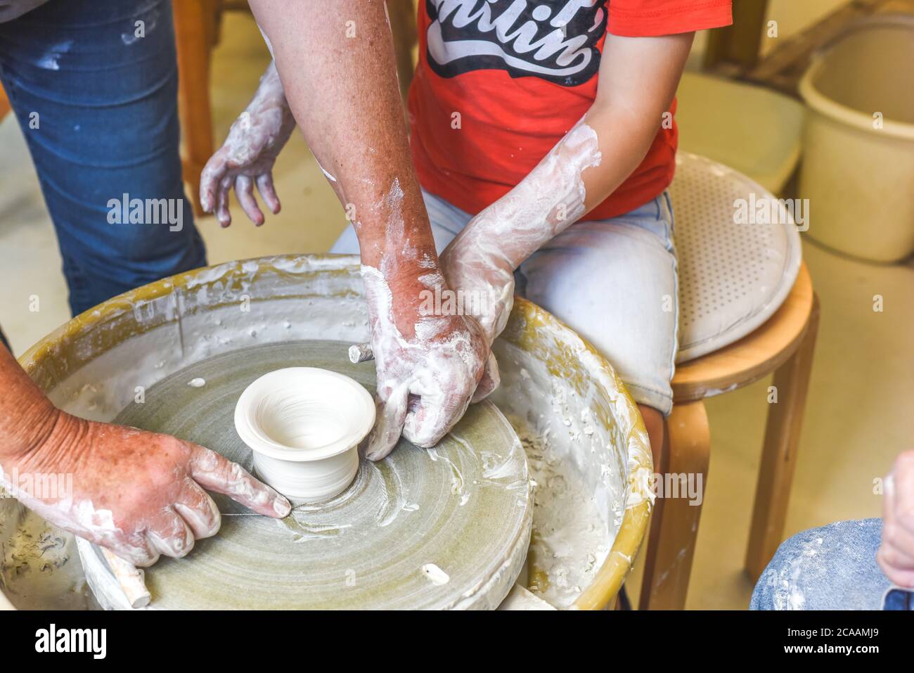Children making pottery during ceramic lesson with clay Stock Photo - Alamy