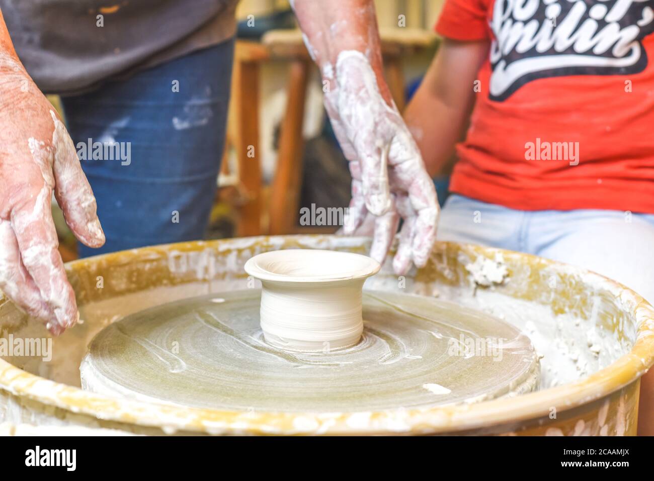 Children making pottery during ceramic lesson with clay Stock Photo - Alamy