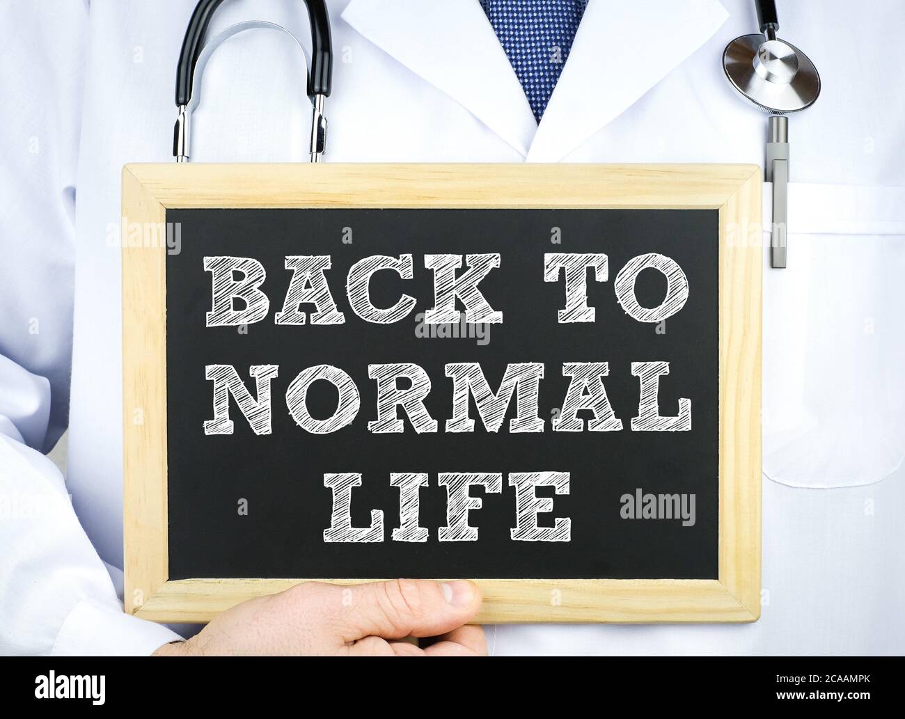 Back to normal life - chalkboard message Stock Photo - Alamy