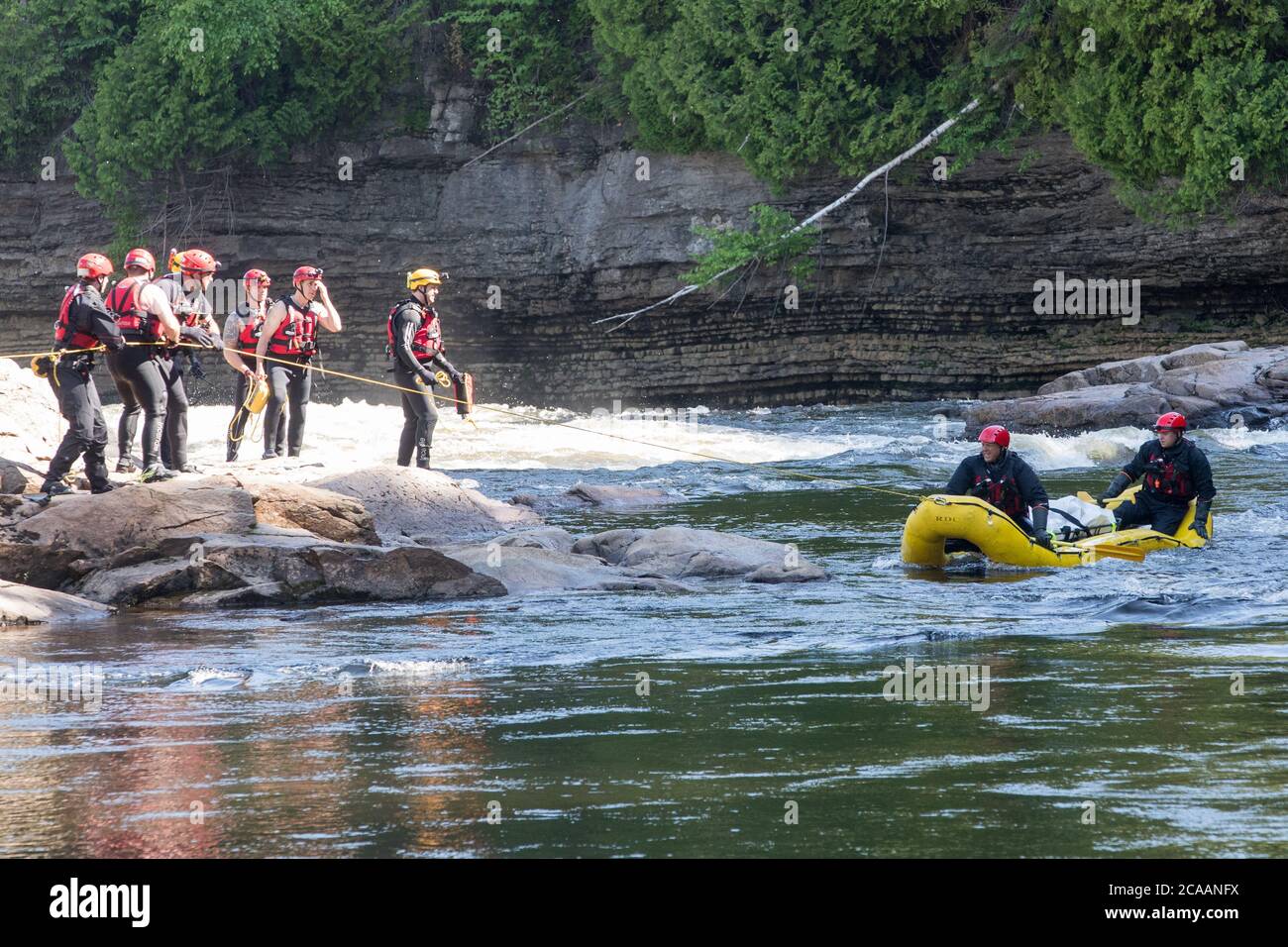 Firefighters bringing drowning victim with inflatable boat Stock Photo ...