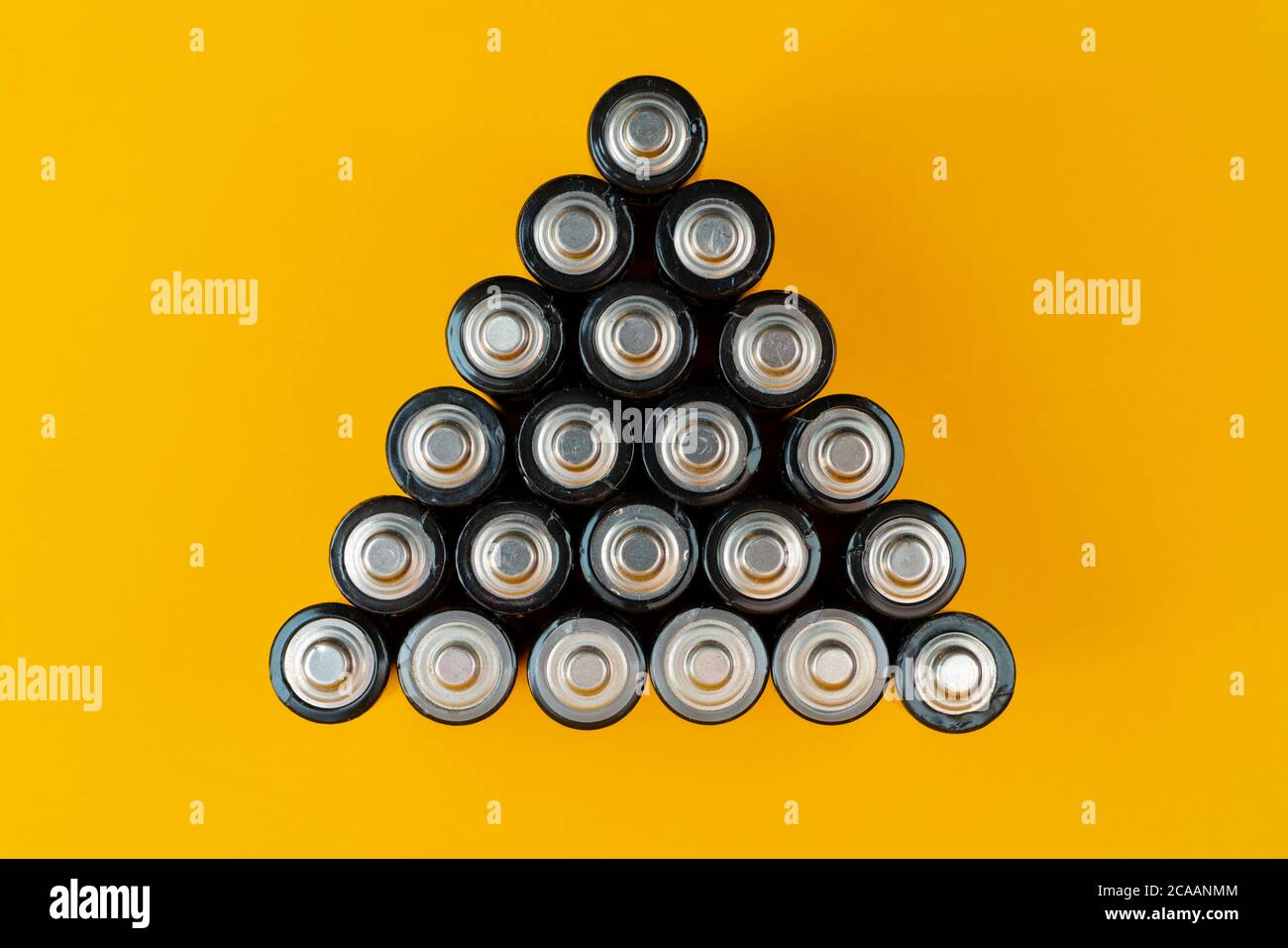 Top view of used batteries arranged in a triangle shape isolated on a ...