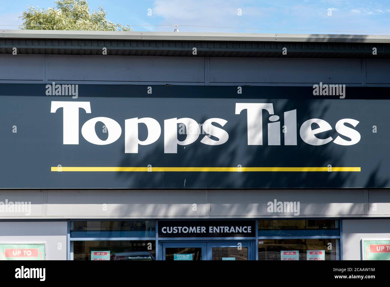 A logo on a branch of a Topps Tiles store in London Stock Photo - Alamy