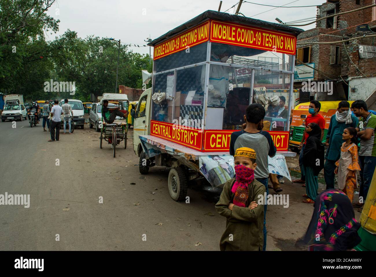 A covid19 mobile testing van is parked at a slum area during a free ...