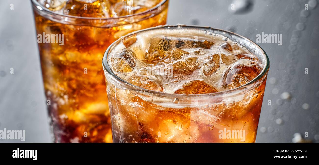 two cups of cold cola soft drink with ice Stock Photo - Alamy