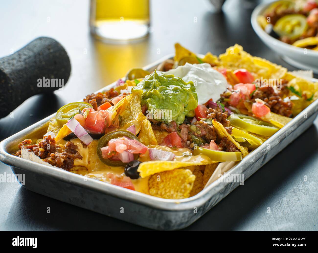 tray of loaded mexican nachos with beef and queso cheese Stock Photo ...