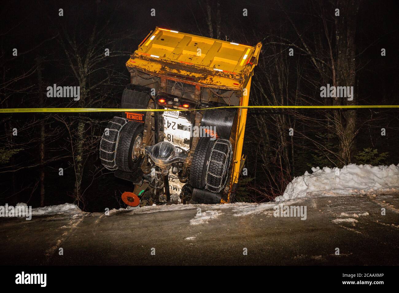 Snow truck falls off road Stock Photo - Alamy