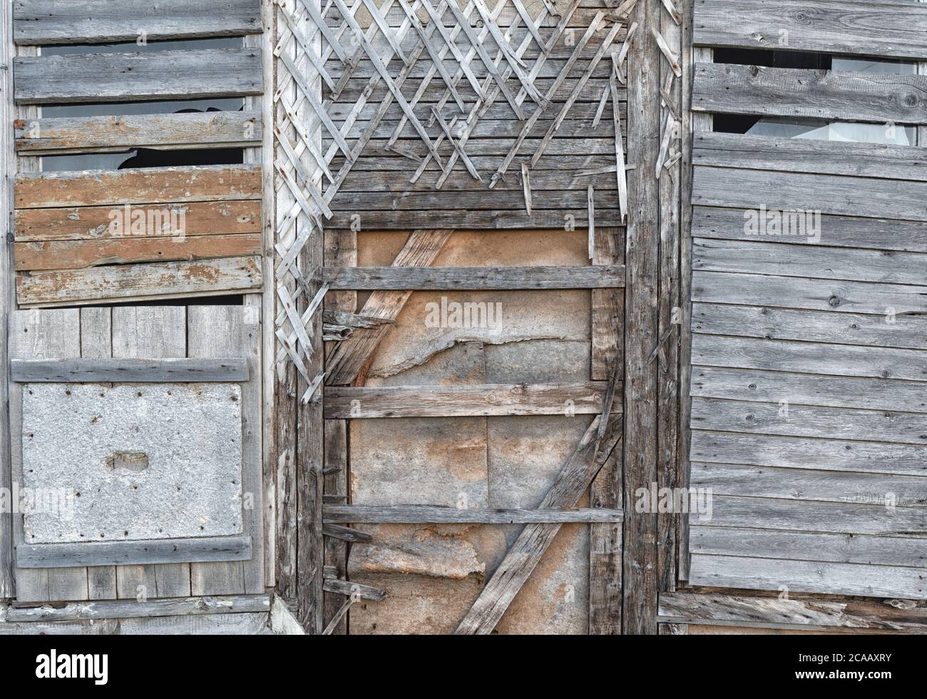 Old wooden walls with plaster crossed base with window covered with ...