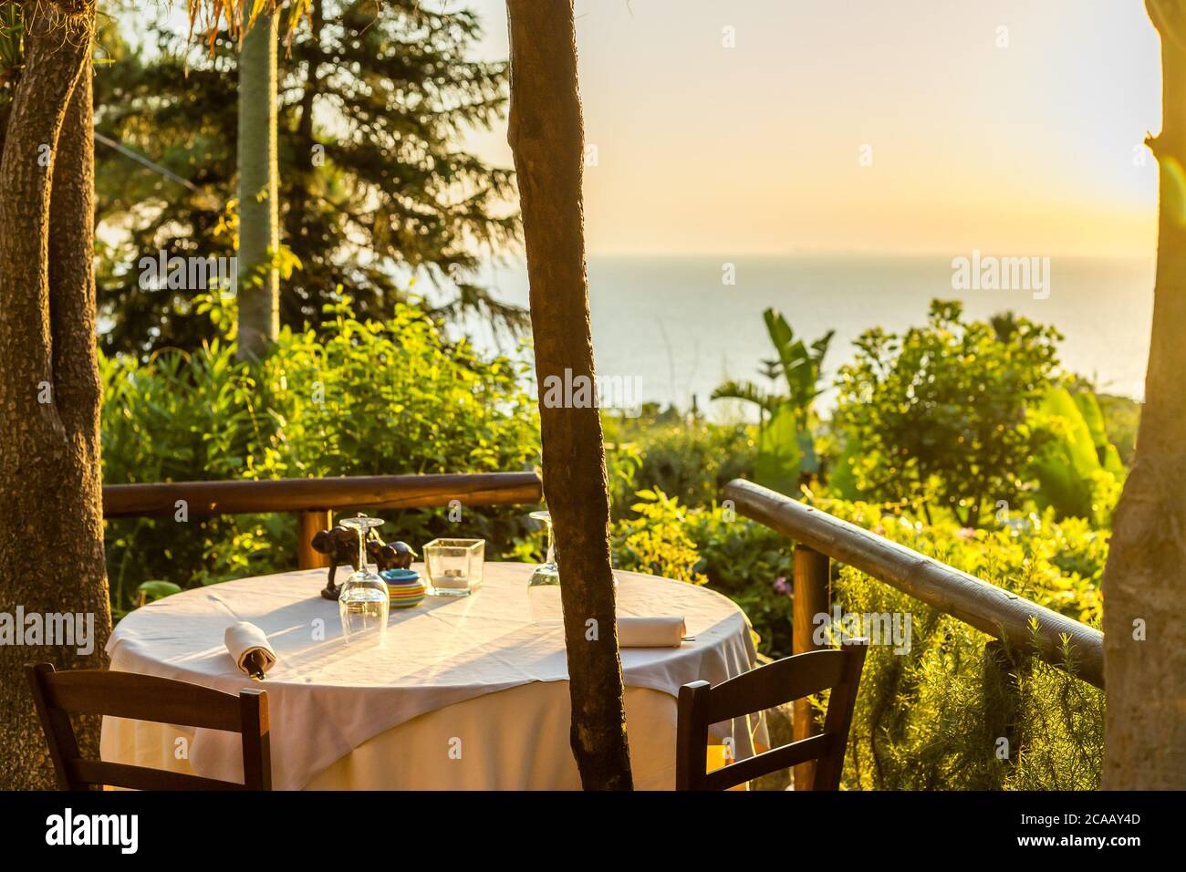 tables of restaurant overlooking the sea in Italy Stock Photo - Alamy