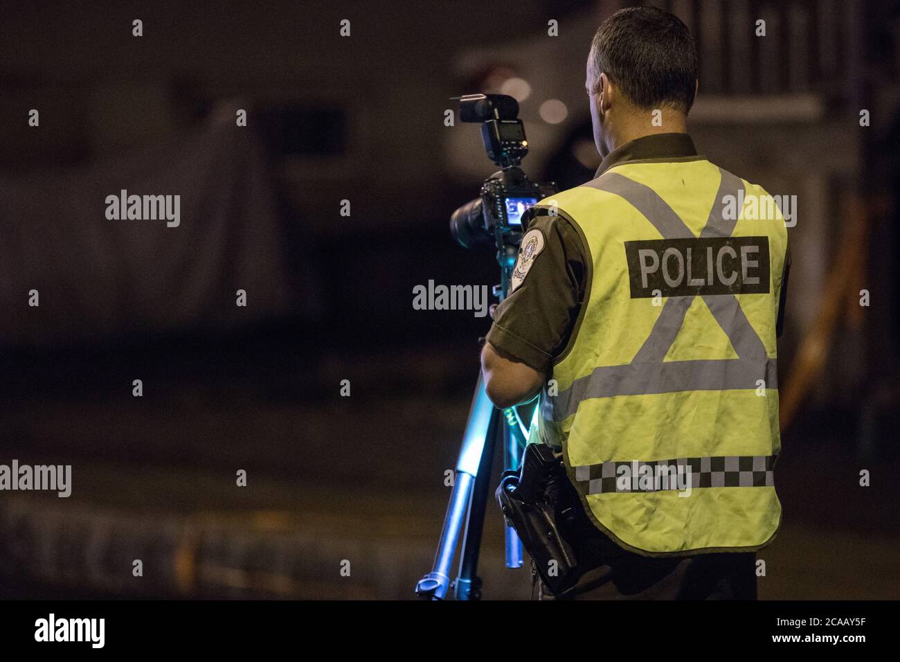 Police officer on crime scene take photo. Editorial use only Stock ...