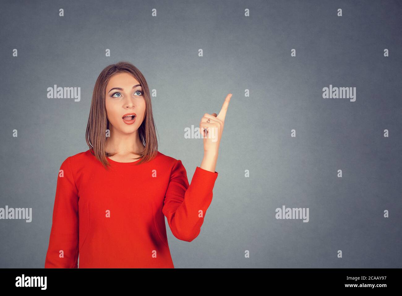 Surprised girl pointing on face hi-res stock photography and images - Alamy