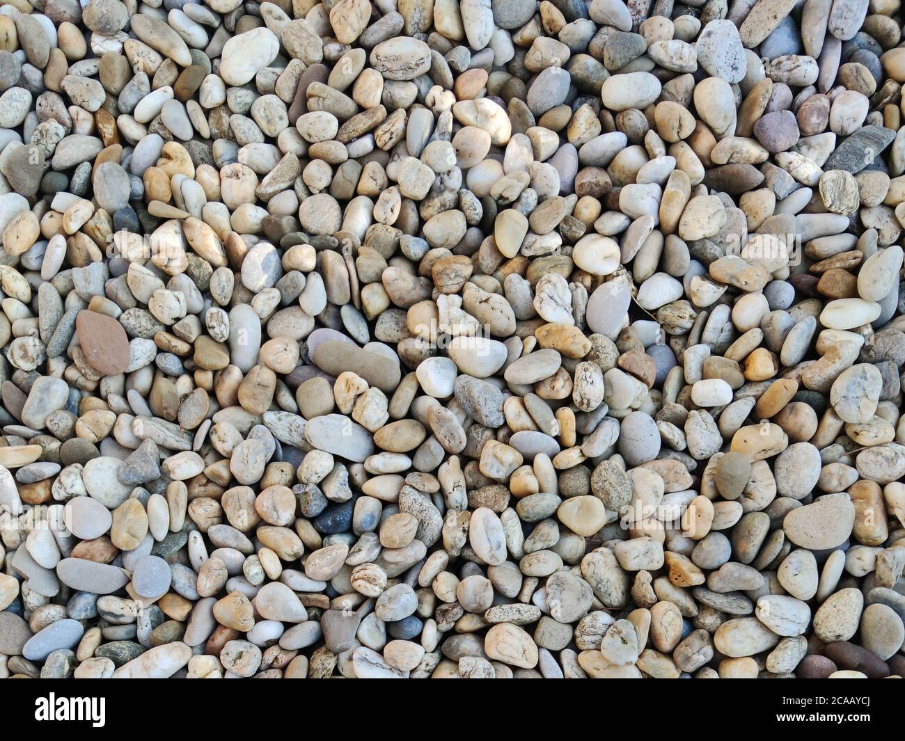 crushed stone on the seashore, Pebble stones background, gravel texture ...