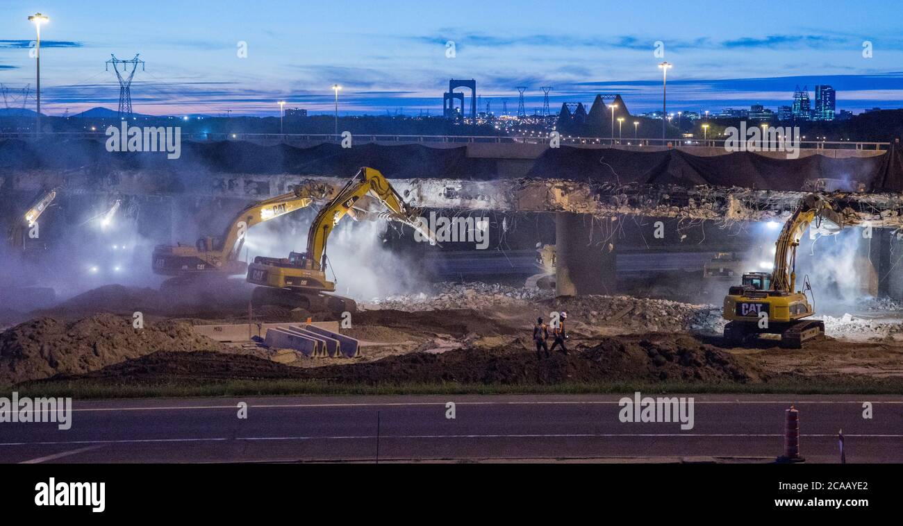 Highway demolition with excavator. Editorial use only Stock Photo - Alamy
