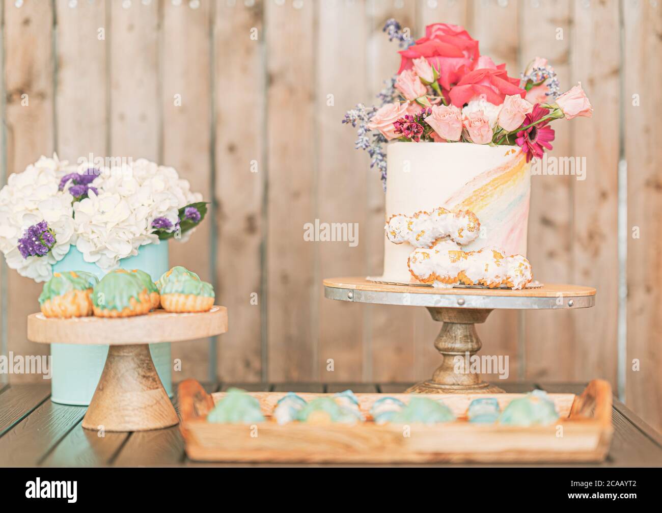 Elegantly Decorated Rainbow Themed Cake with Cream Puffs, Pastel ...