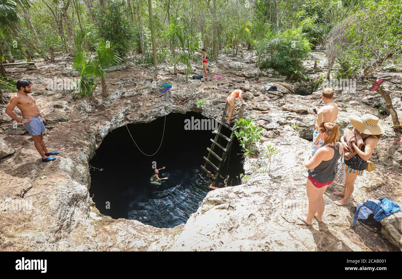 TULUM, MEXICO - Oct 11, 2019: Visitors take in the site and unique cave ...