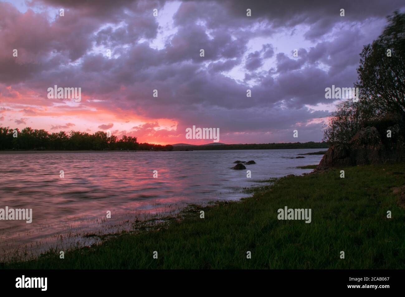 River under thunderhead clouds sky Stock Photo - Alamy