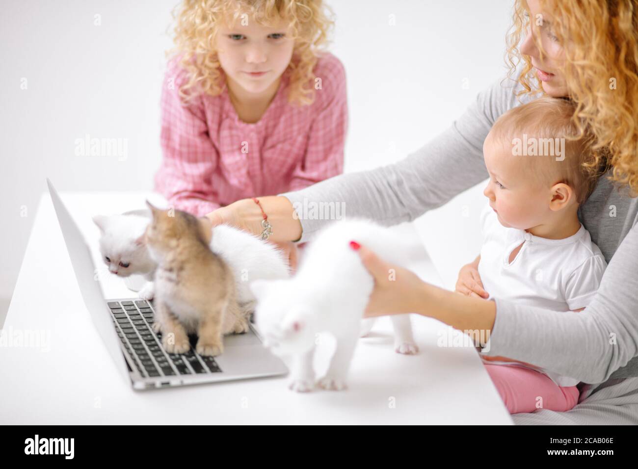 new members of family. close up photo. mother teaching a child to count ...