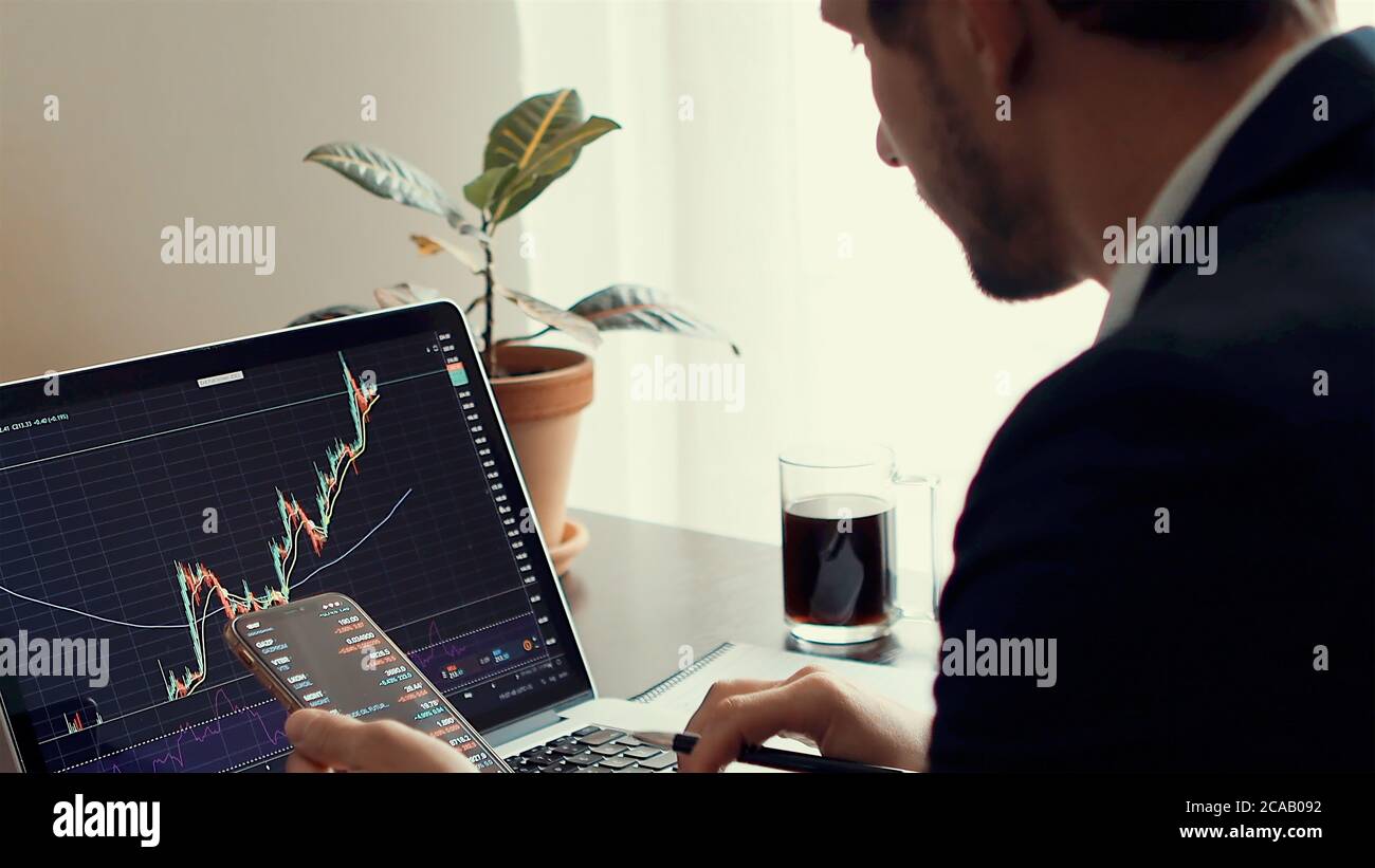 investment stockbroker stock market trading working day Stock Photo - Alamy