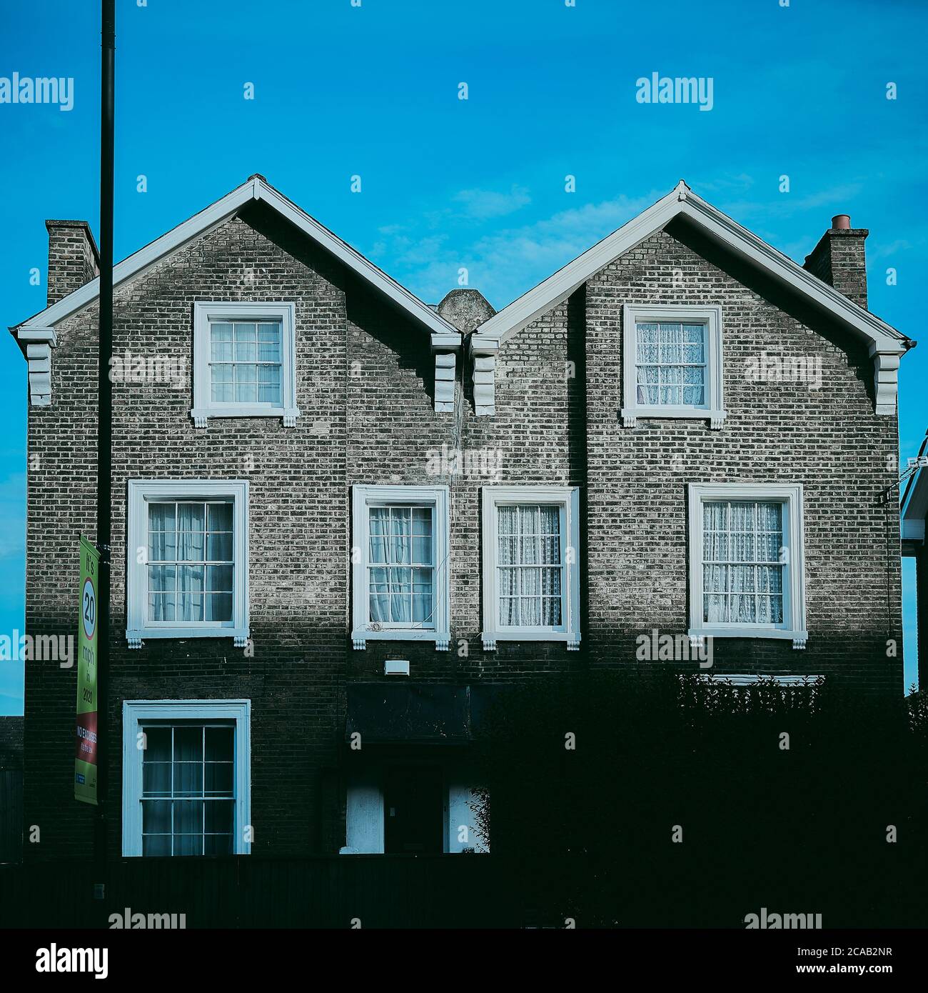Beautiful shot of a house made of bricks with a clear blue sky Stock ...