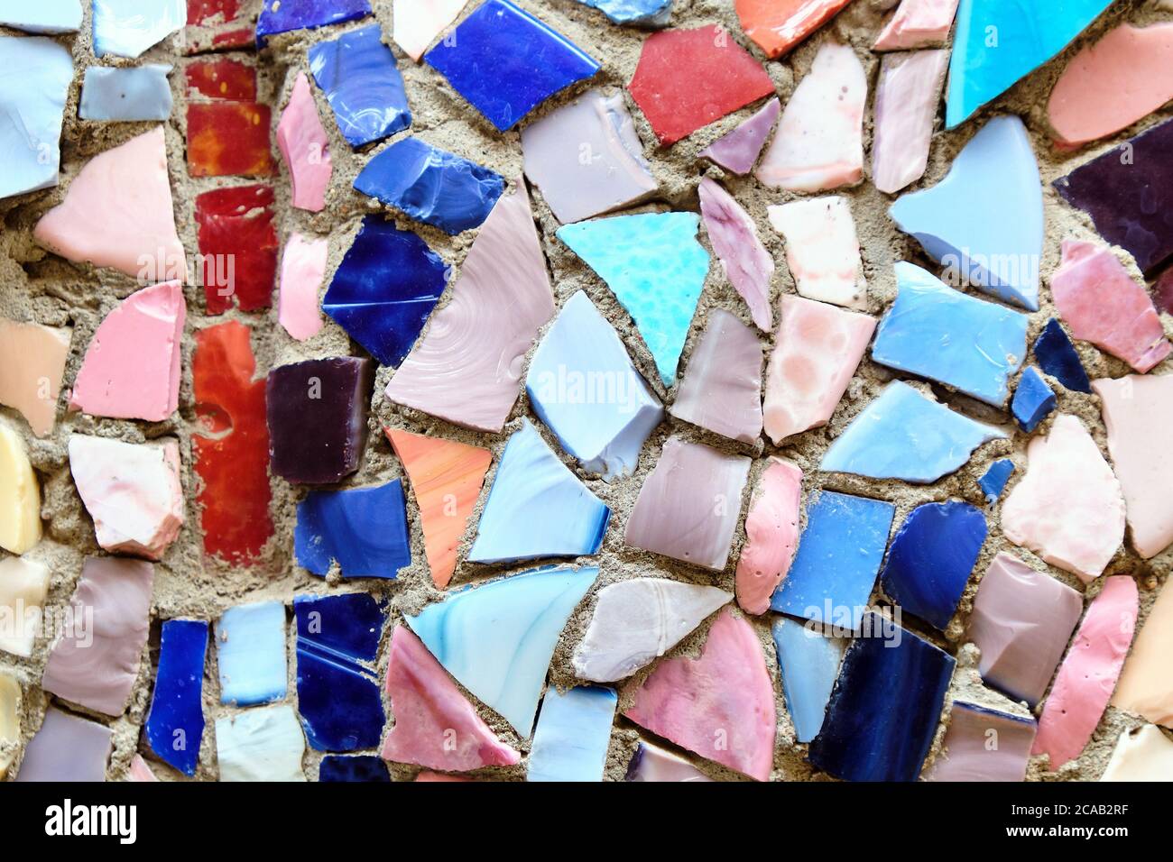 Background from a mosaic of different shapes of tiles and multicolors ...