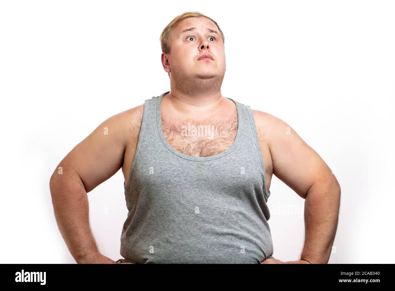Excited kind-hearted chubby overweight man feeling happy looking up at ...