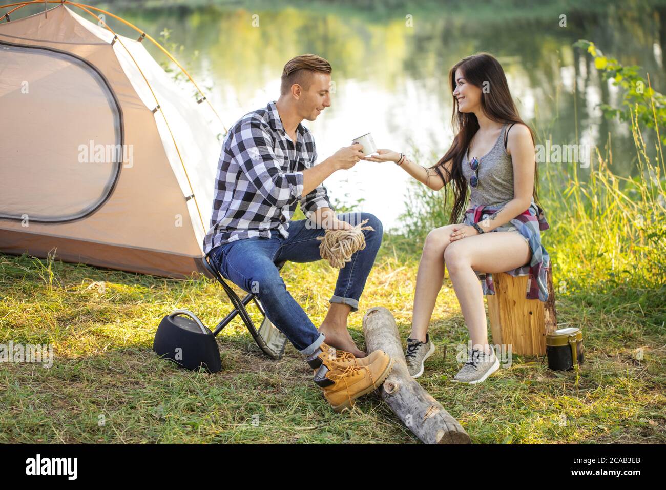 awesome girl is giving water to her boyfriend while resting in the ...