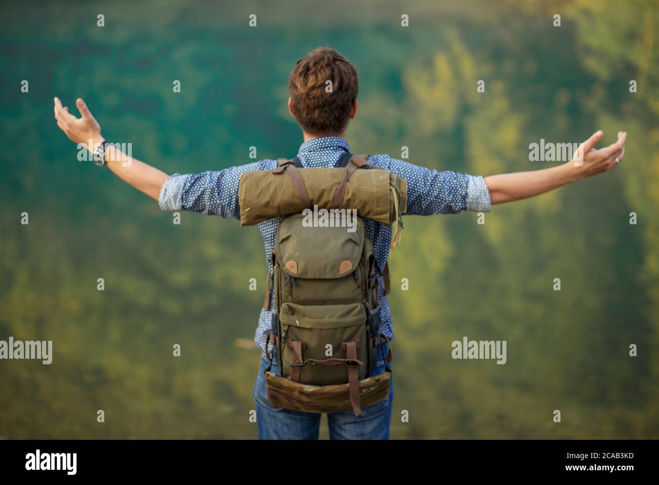 excited guy with stretched arms getting pleasure from the beauty of ...