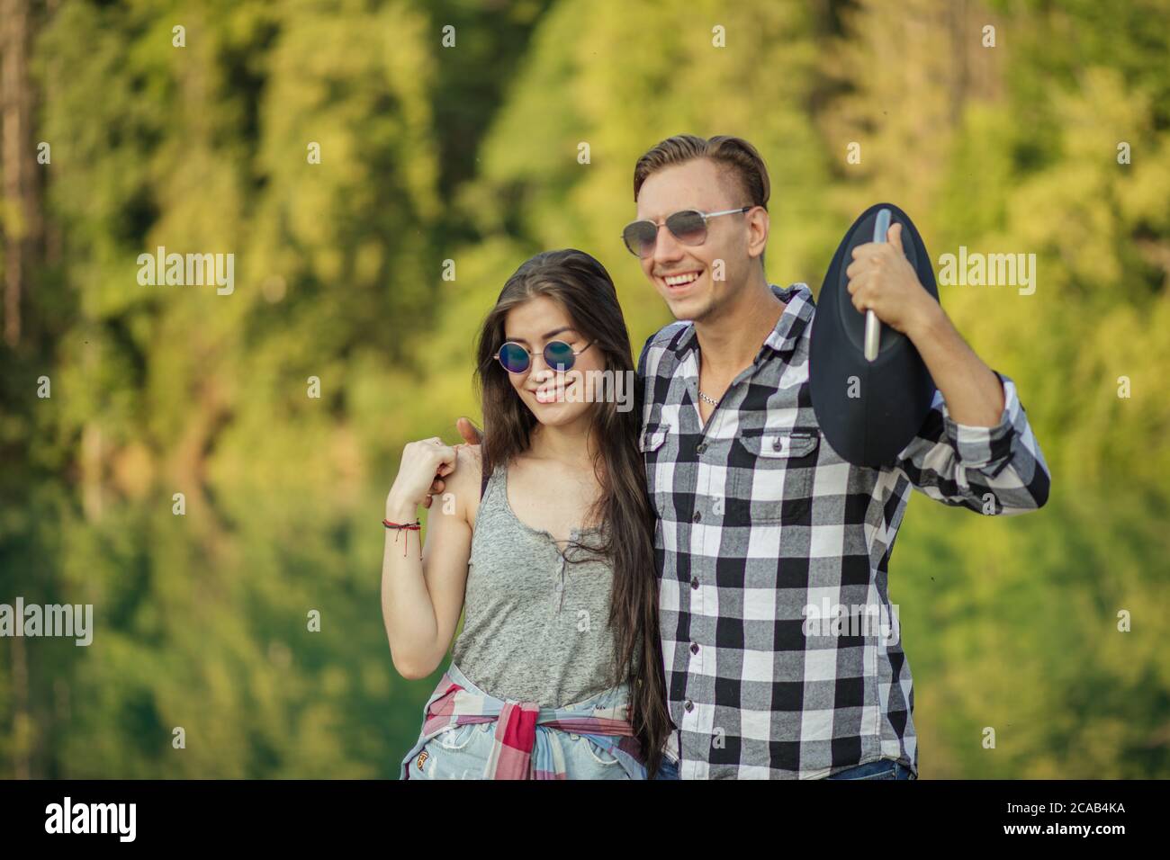 happy pleasant enamored man with a tape recorder on his shoulder is ...