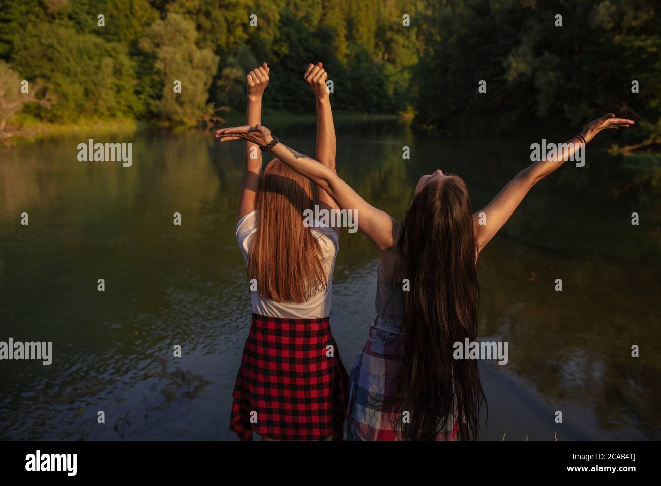 two good looking girls are rejoicing at great breathtaking landscape of ...