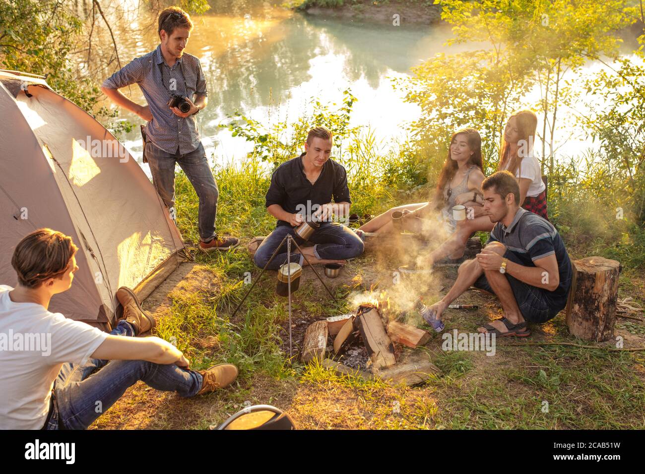 a group of young people are resting in the nature. tourism , weekend ...