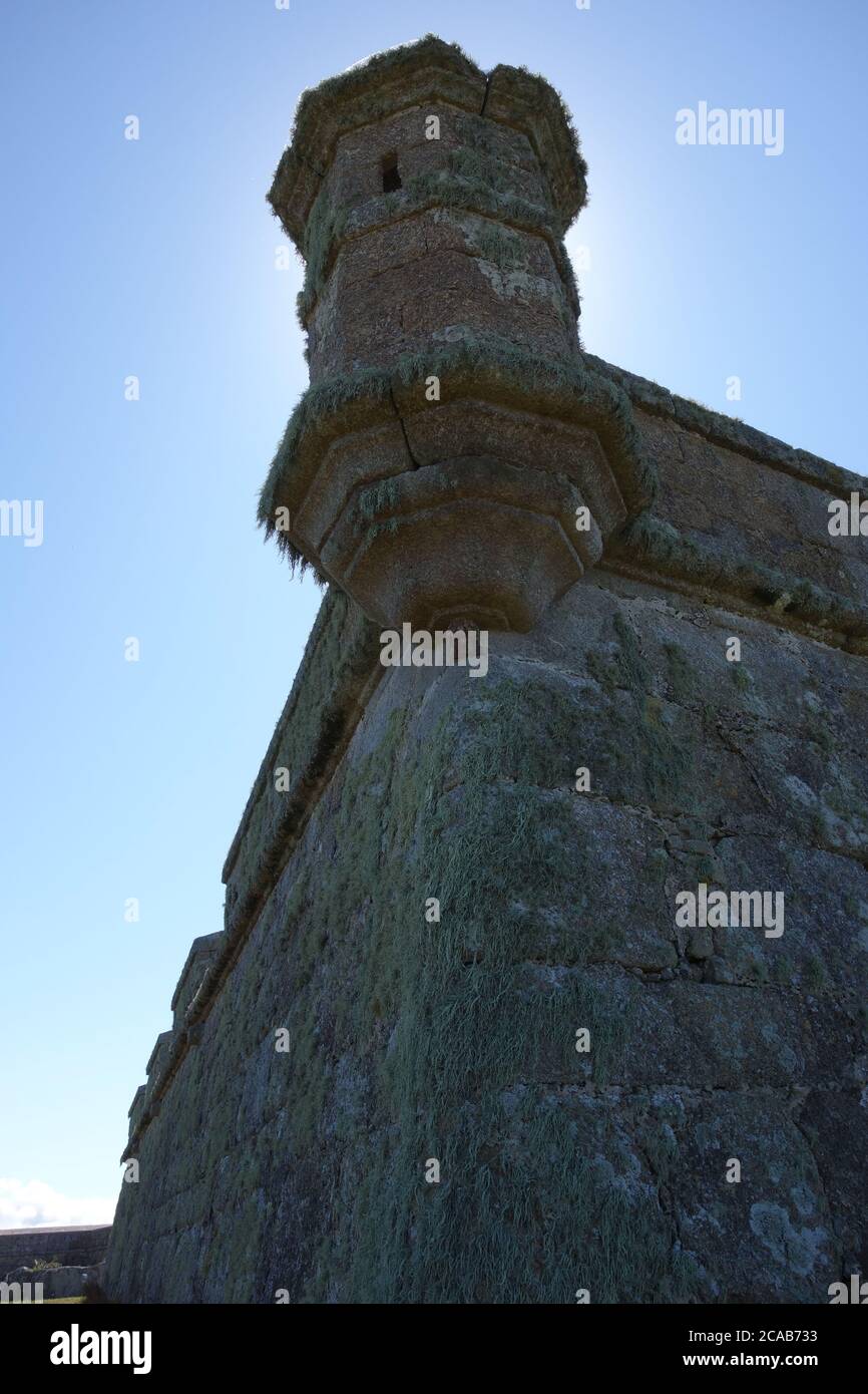 Vertical low angle shot of a castle wall with a small observation point ...