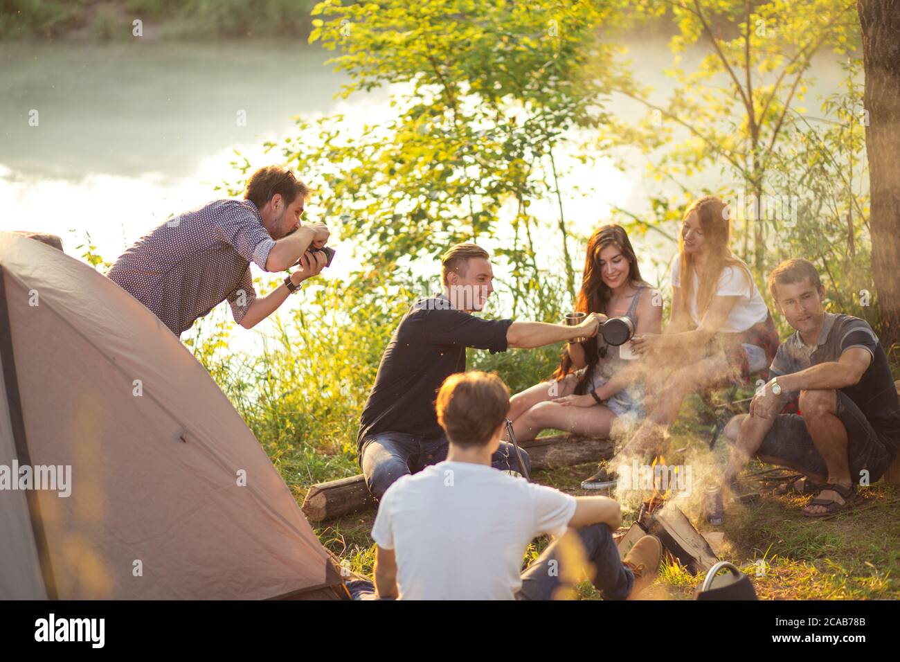 friendly company drinking tea in landscape. free time , rest time ...
