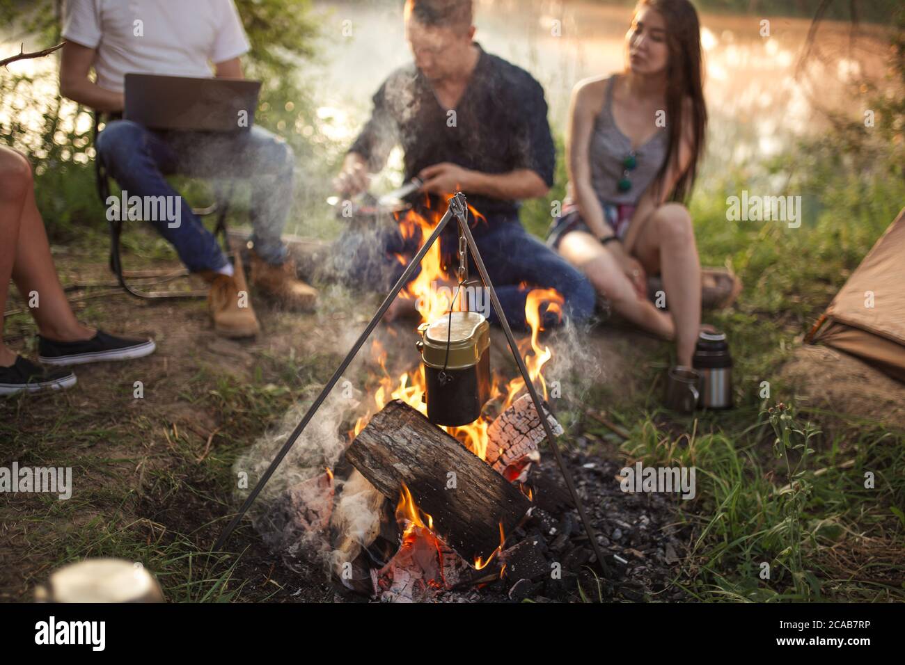 Cooking in a pot on campfire. closeup photo of a great bonfire at ...