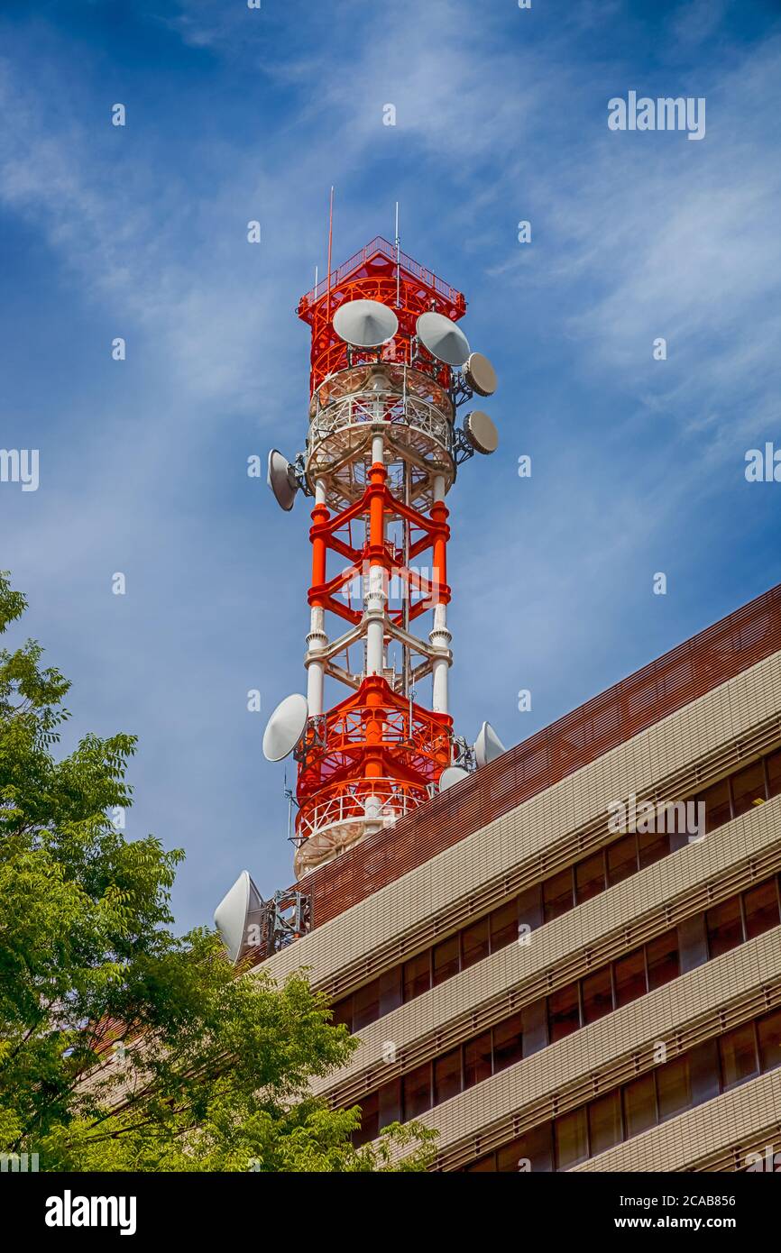 Communications tower with a beautiful blue sky Stock Photo - Alamy