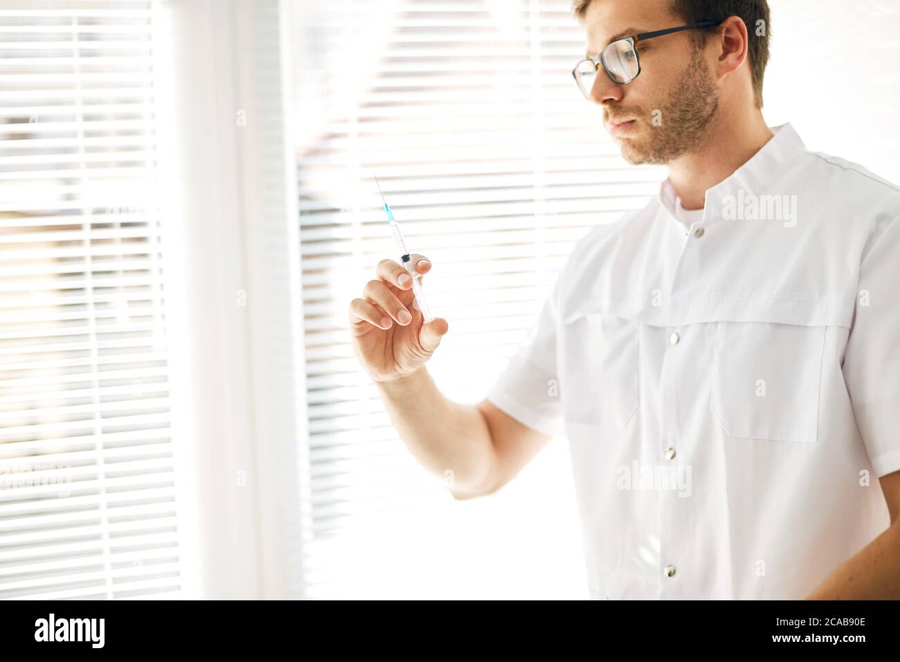 doctor wants to sedating the client. close up side view photo. copy ...