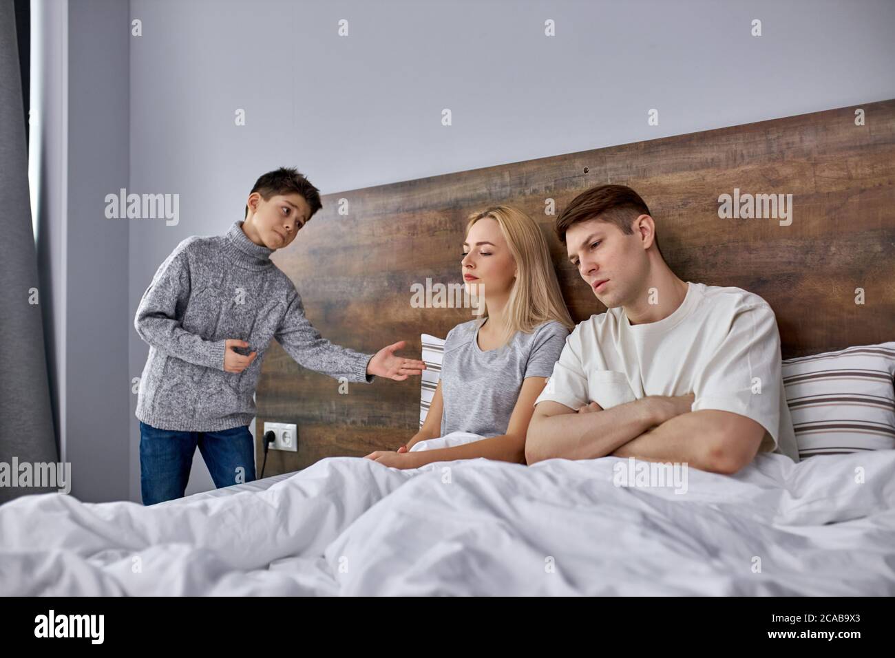 little child ask parents to stop quarreling, offended parents lie on ...