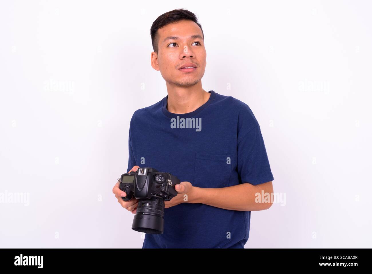Portrait of young Asian man with camera Stock Photo - Alamy