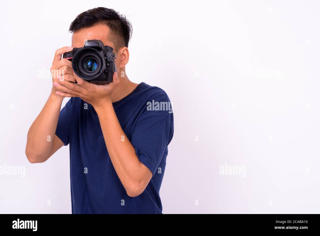 Young asian man photographer hi-res stock photography and images - Alamy