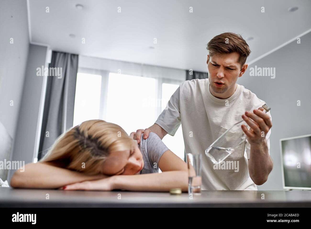 husband dissatisfied with his wife an alcoholic, angry man look at ...